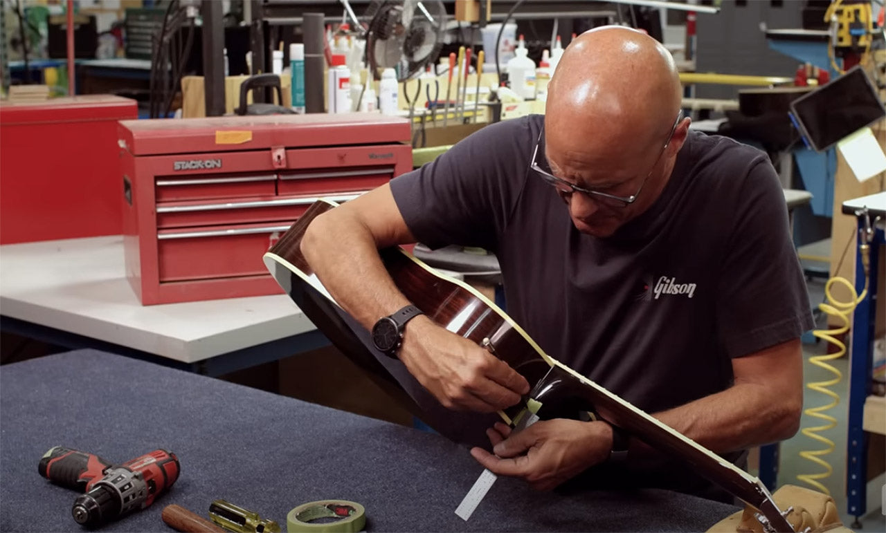 Video: How to install a strap button on an acoustic guitar - Gibson Gazette
